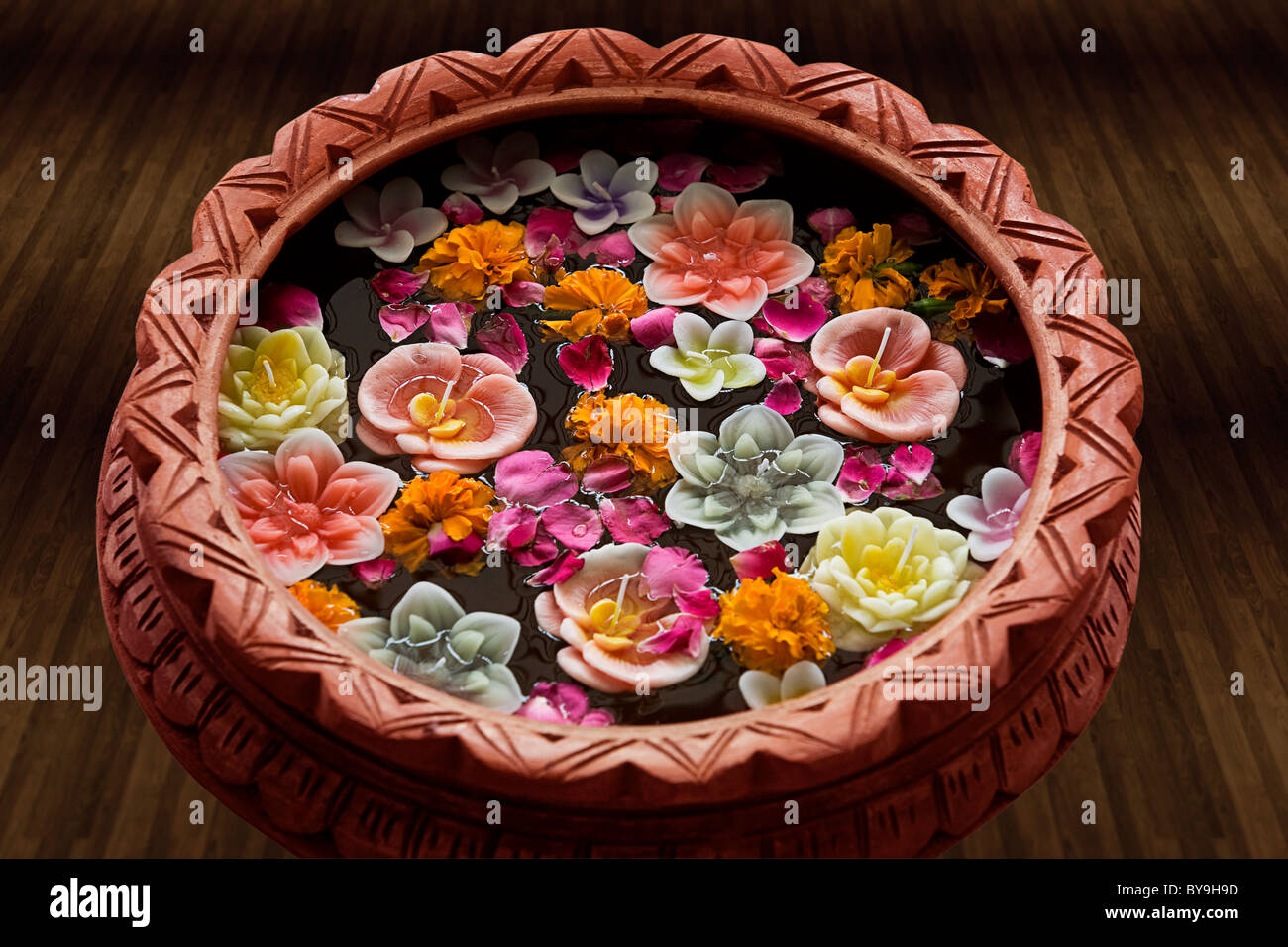 Flower diyas floating in a pot with water Stock Photo - Alamy