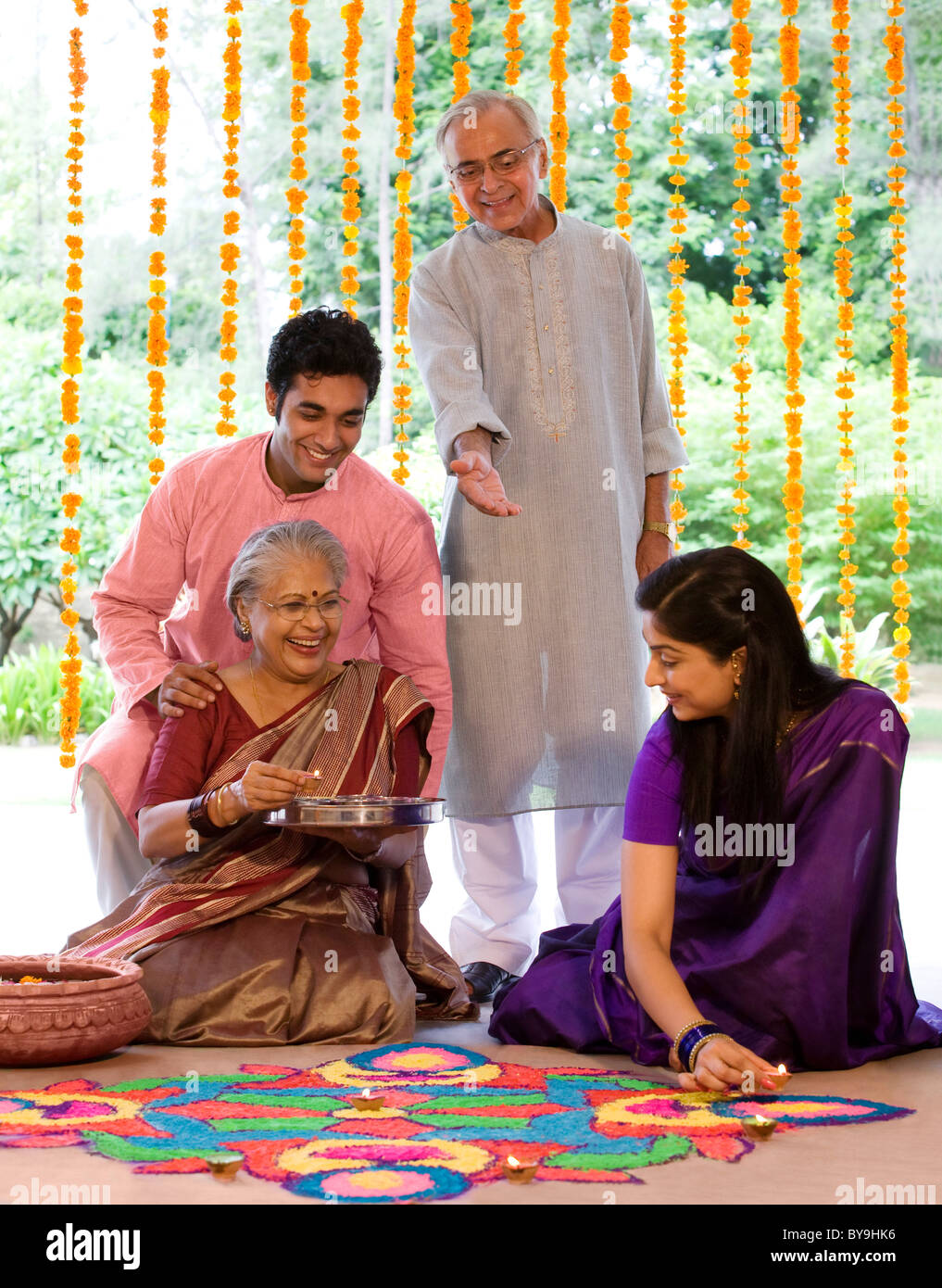 Mother daughter making rangoli hi-res stock photography and images - Alamy