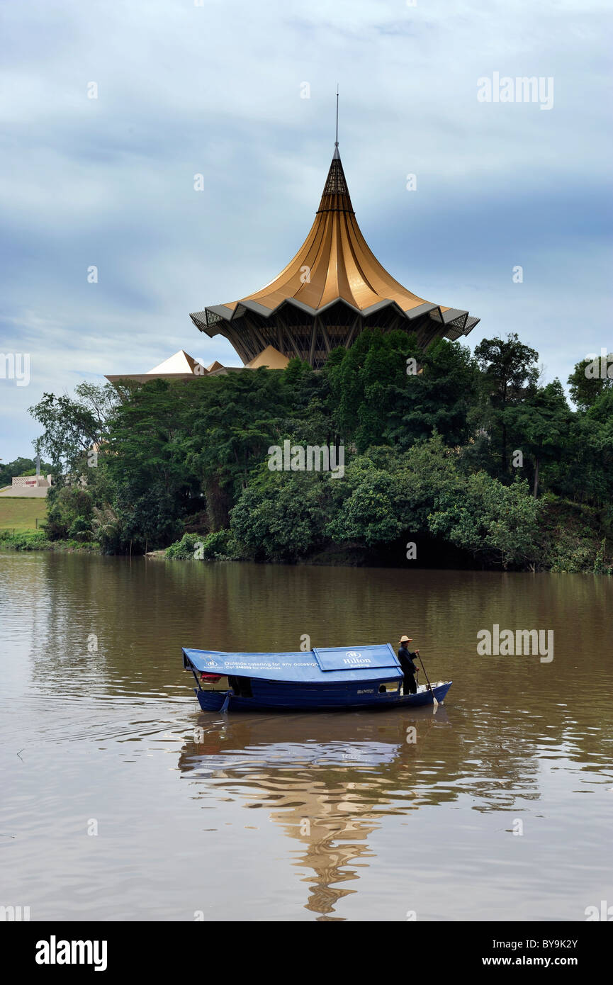 A sampan river taxi passing by the State Assembly building, Dewan ...