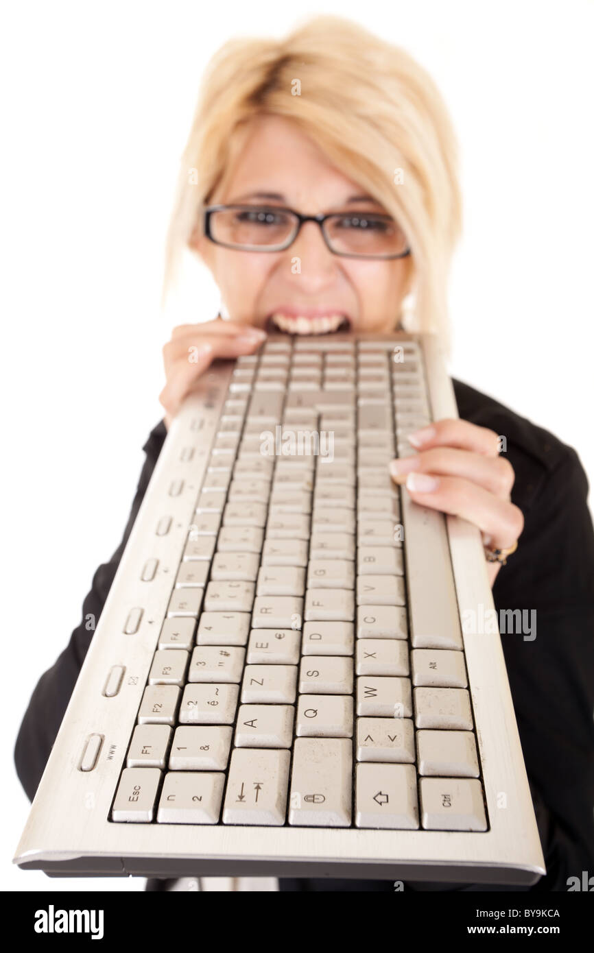 stressed business woman biting computer keyboard Stock Photo - Alamy