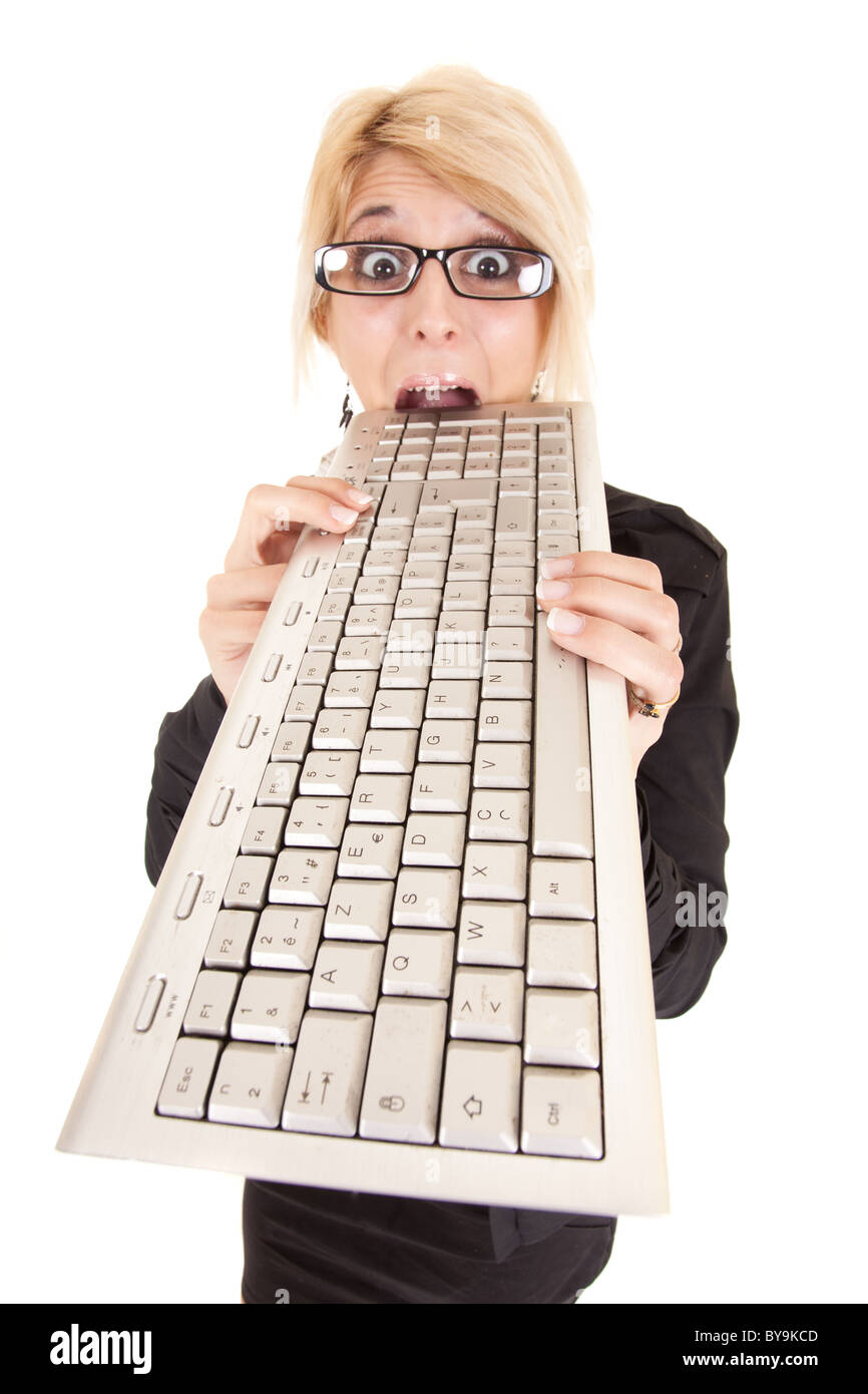 stressed business woman biting computer keyboard Stock Photo - Alamy