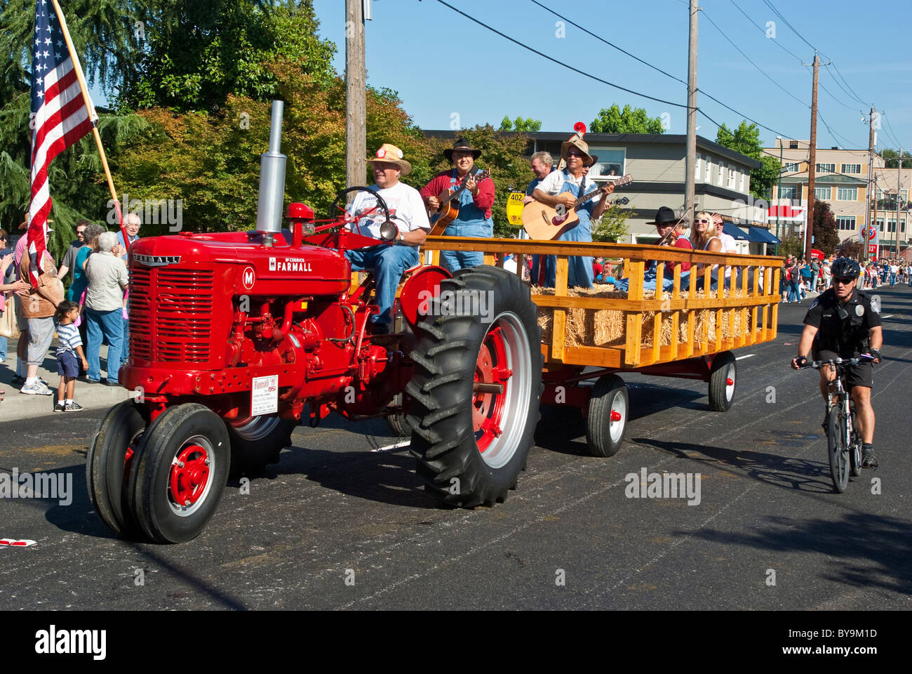 US, Washington, Puyallup. Western band rides hay wagon in Western Rodeo ...