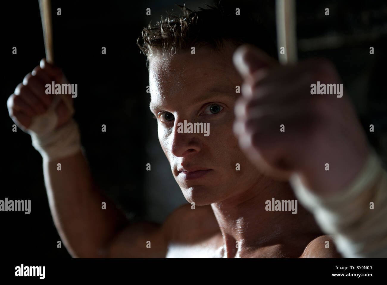 A portrait of physically active man working at the gym Stock Photo - Alamy