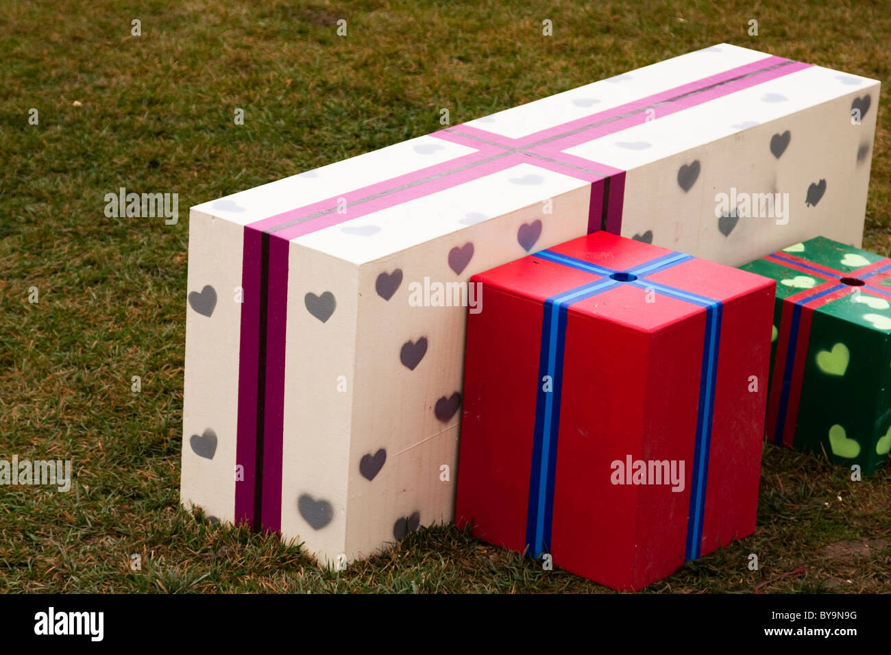 many gift boxes on the grass Stock Photo - Alamy