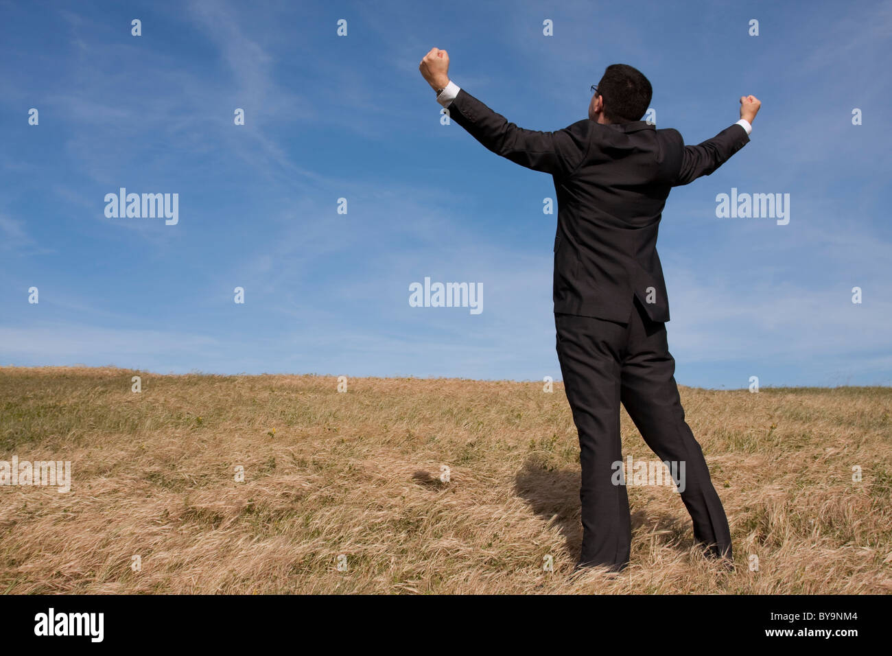 businessman showing his success at the field Stock Photo - Alamy