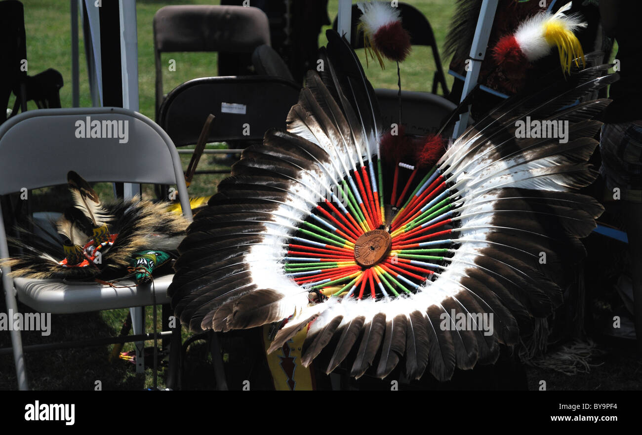 A dance bustle and head dress lay on chairs at the Cherokee Pow Wow in ...
