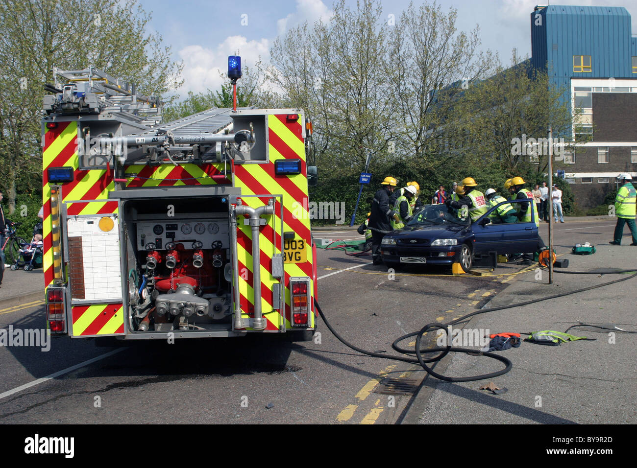 Fireman using cutting equipment Stock Photo - Alamy
