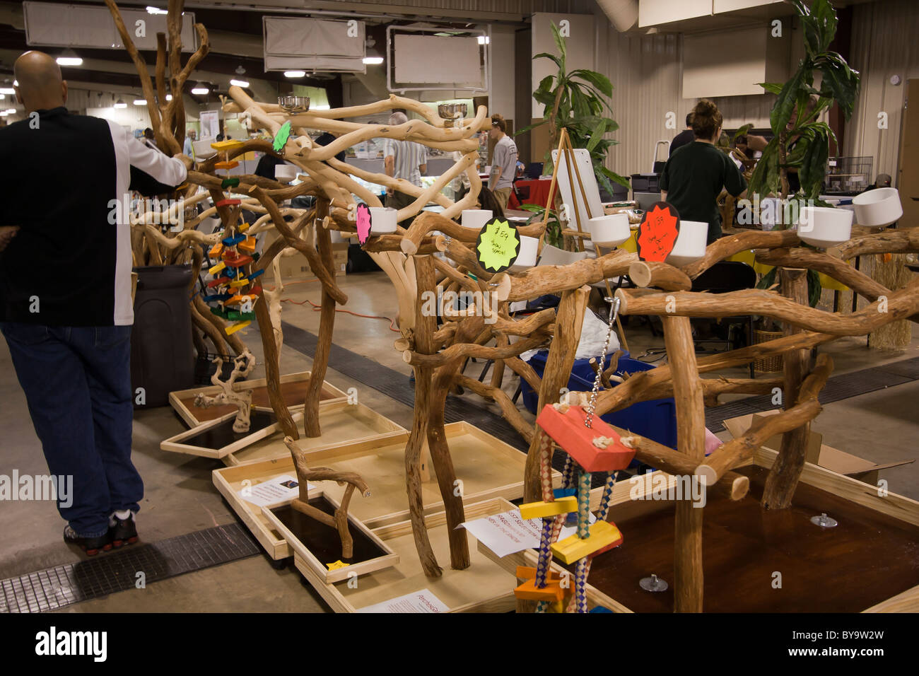 Bird stands for sale at a bird expo Stock Photo - Alamy