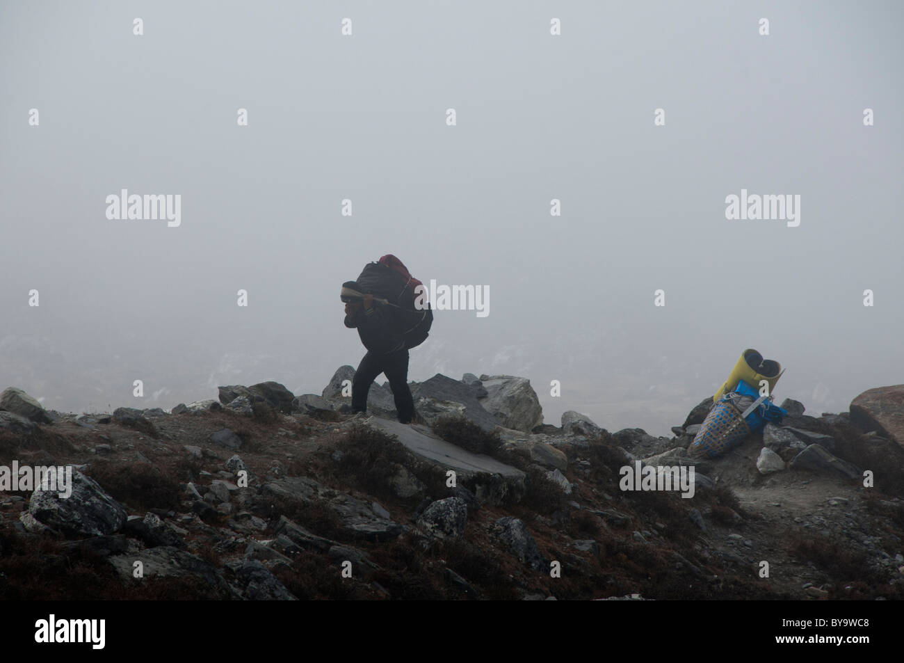 porter in the mist in the Everest Region of Nepal Stock Photo - Alamy