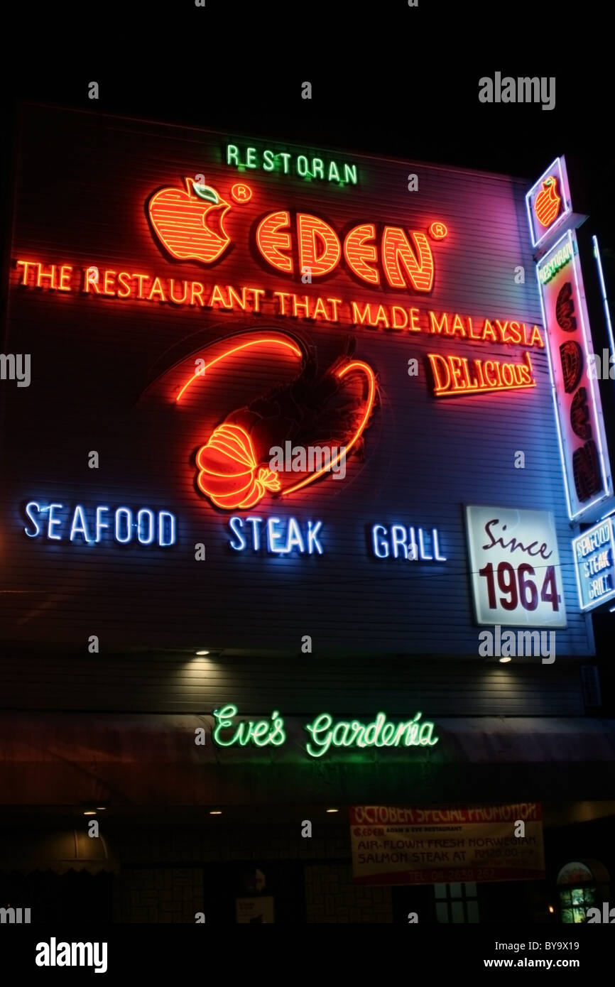 A bright neon sign marks the location of the Eden Restaurant in ...