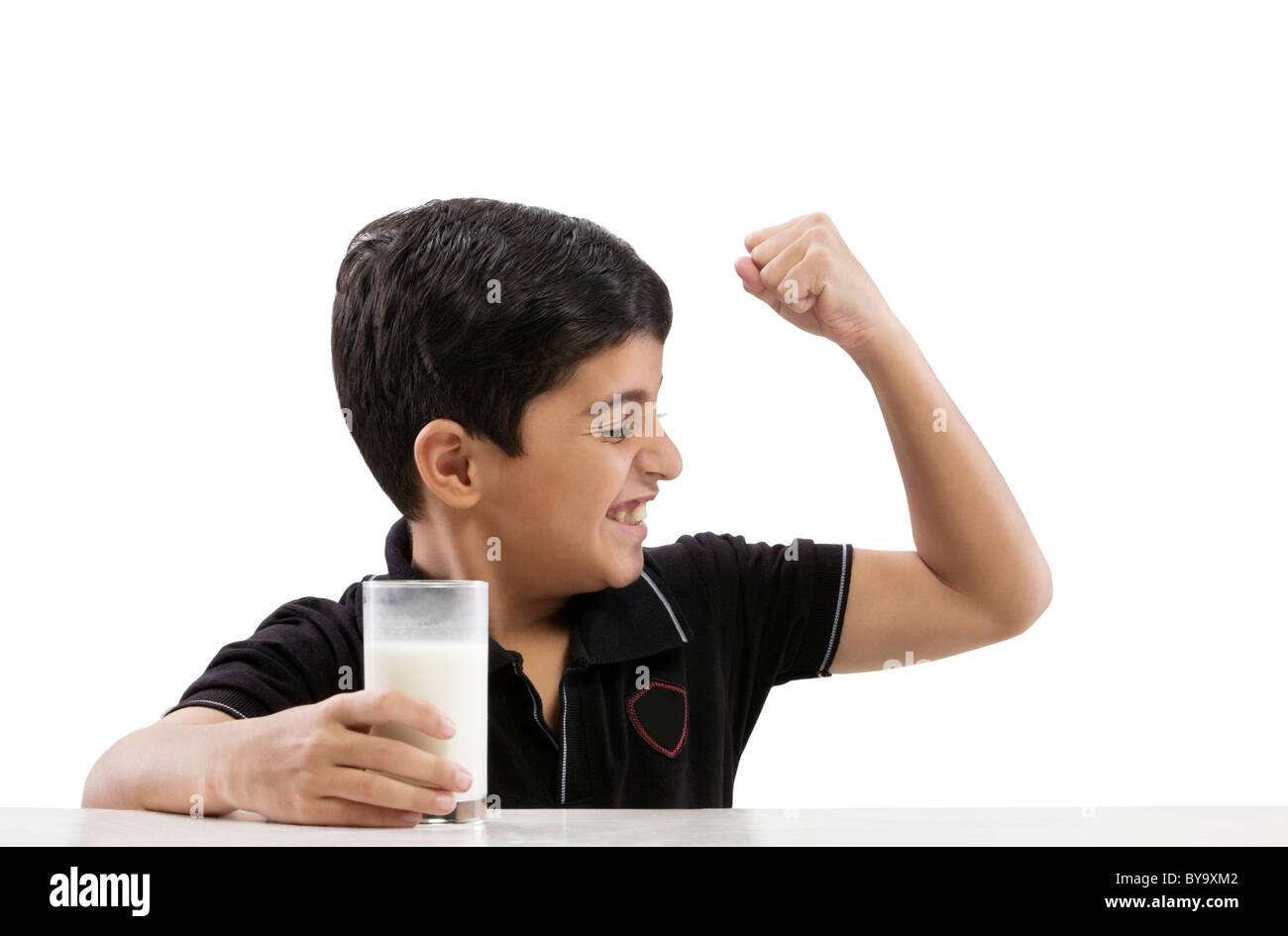 Young boy flexing his arm Stock Photo - Alamy