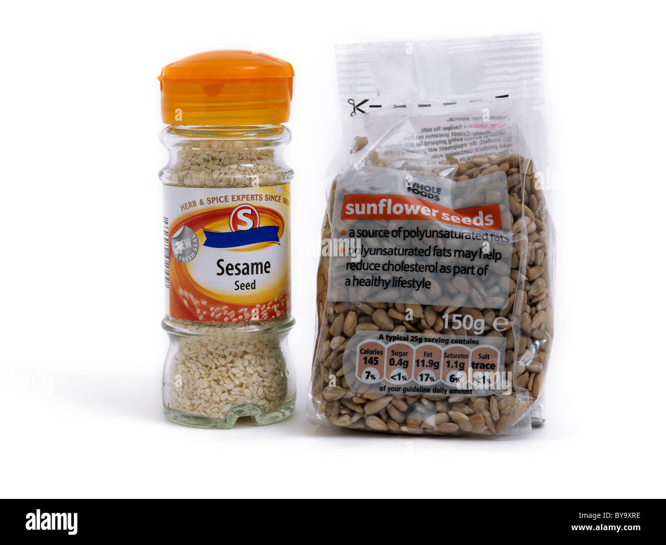 Container With Sesame Seeds And Pack Of Sunflower Seeds Stock Photo - Alamy