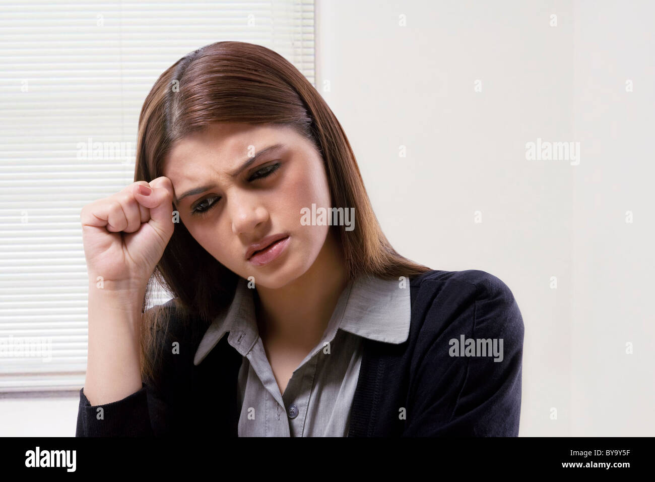 Businesswoman thinking hard Stock Photo - Alamy