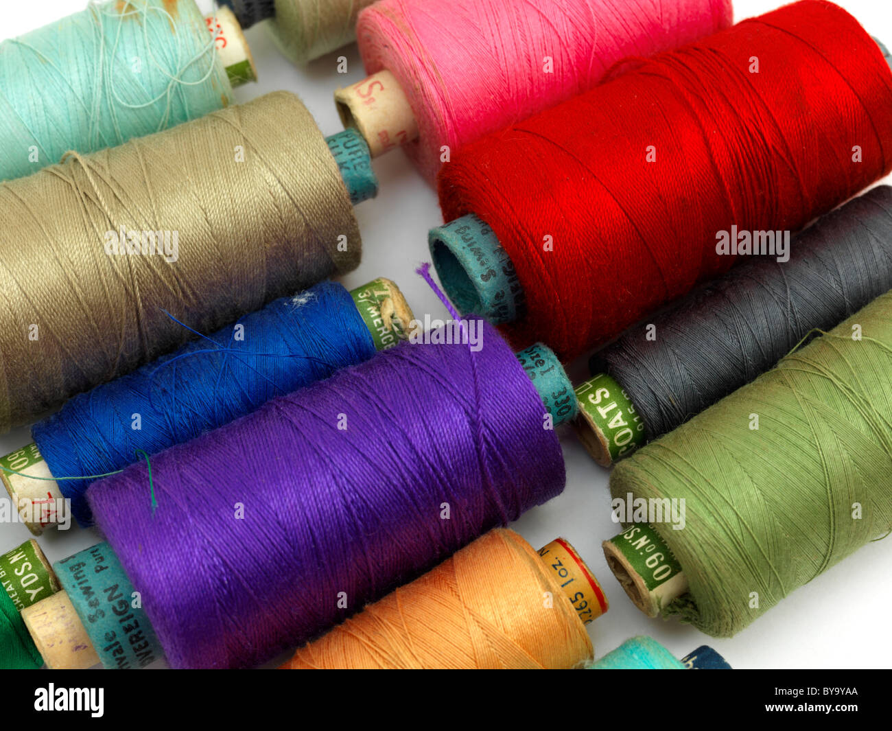 Pile Of Spools Of Colourful Cotton Stock Photo - Alamy