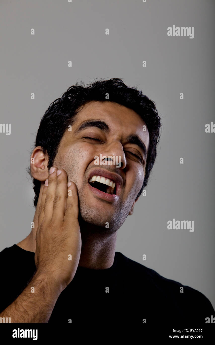Man with a toothache Stock Photo - Alamy