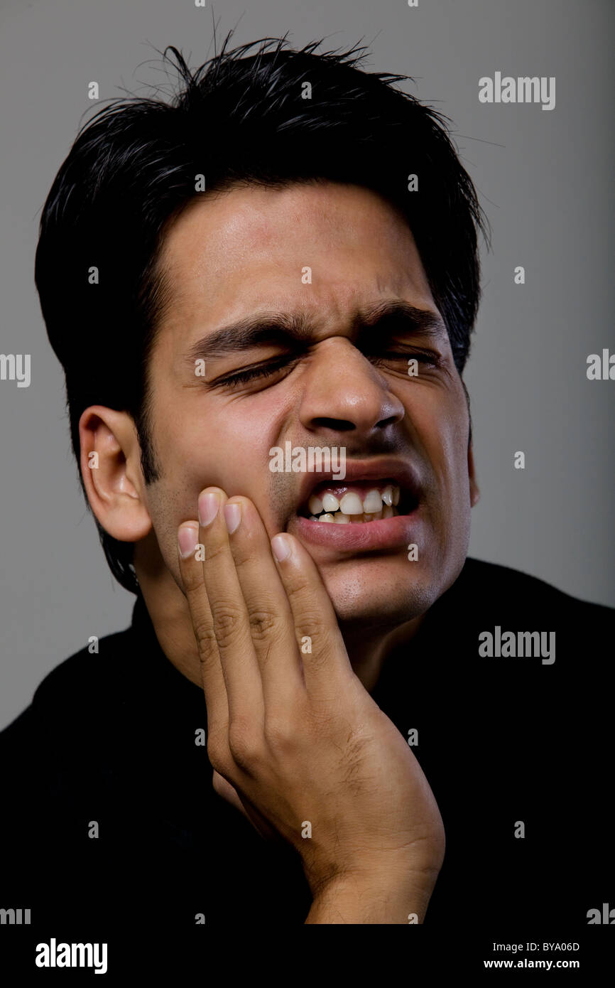 Man with a toothache Stock Photo - Alamy