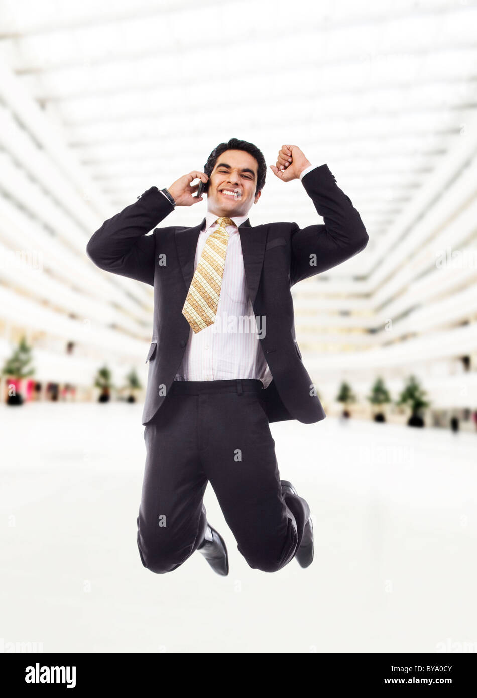 Person jumping in air office attire hi-res stock photography and images ...