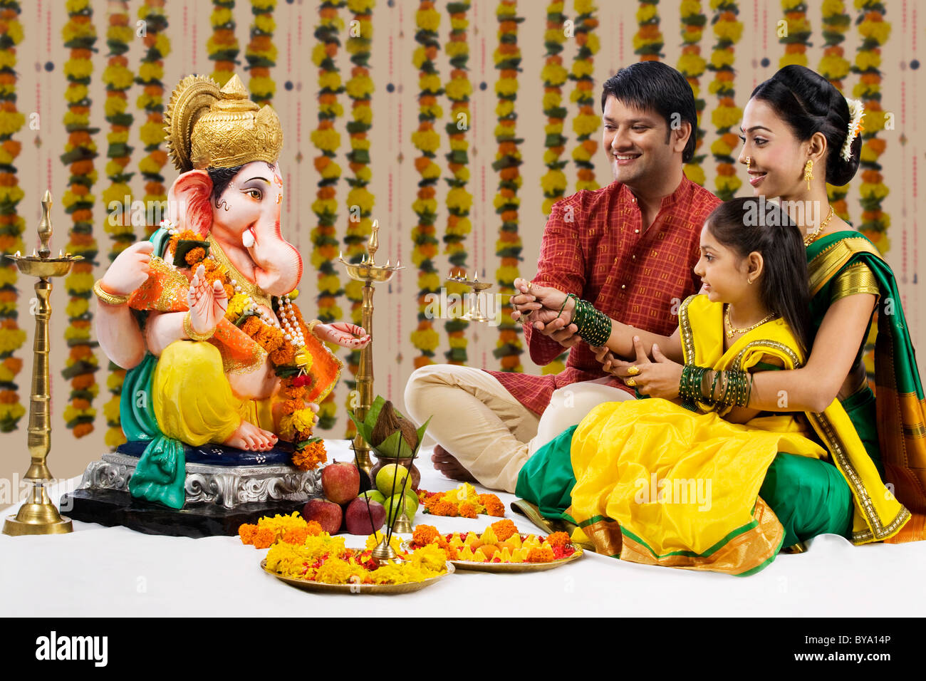 Family performing a pooja Stock Photo - Alamy