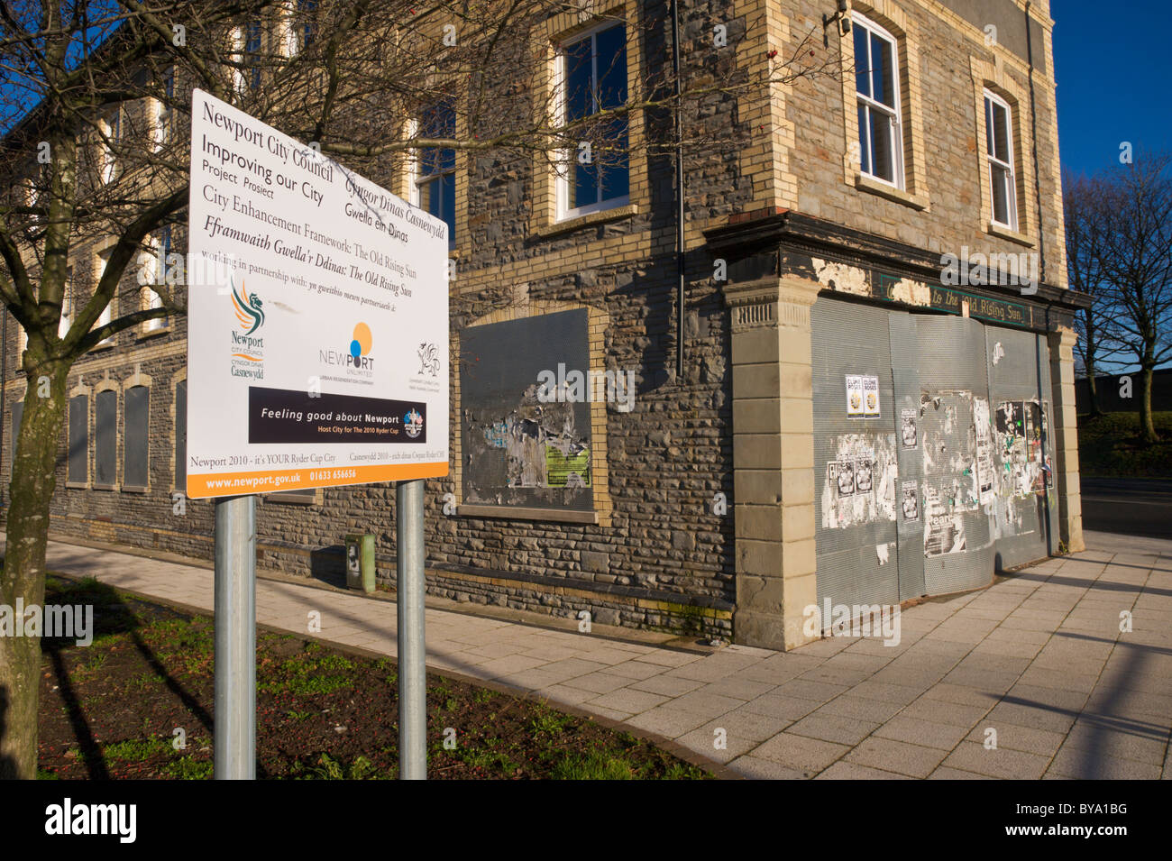 City improvement sign outside boarded up pub in Newport South Wales UK ...