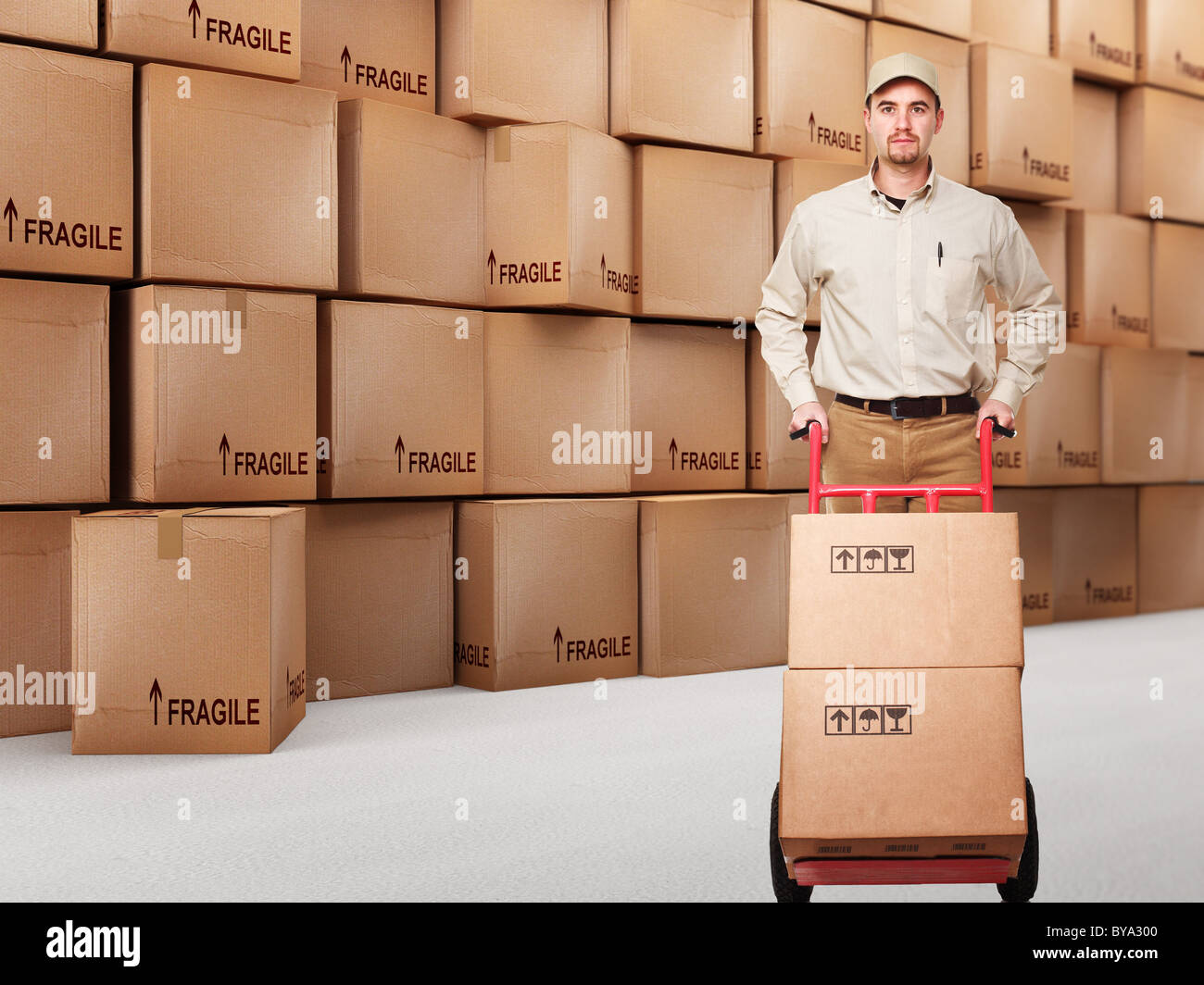 delivery man at work and 3d boxes background Stock Photo - Alamy