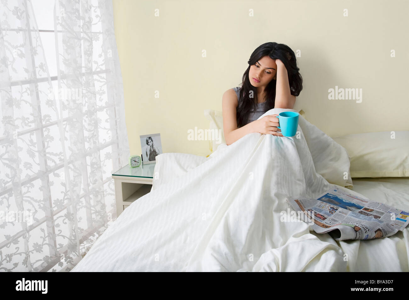 Girl with a cup of coffee thinking Stock Photo - Alamy Girl with a cup of coffee thinking Stock Photo - Alamy