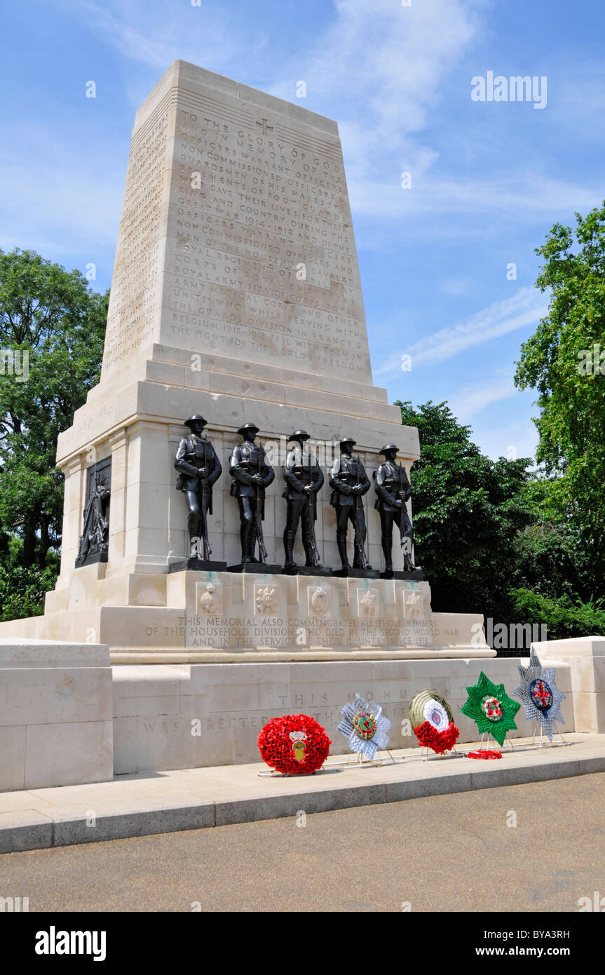 Wreaths at Portland stone obelisk & five bronze sculptures on Guards ...