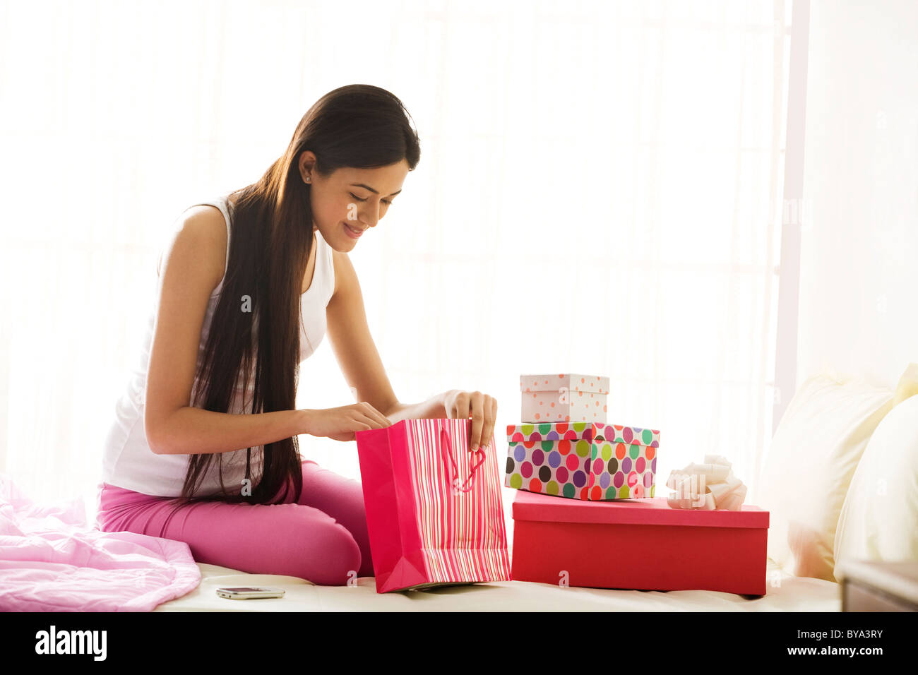 Gifts in bag hi-res stock photography and images - Alamy
