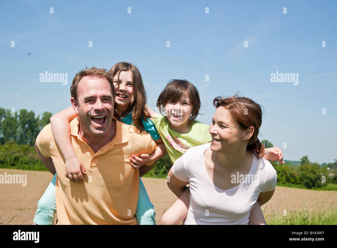One or more children carrying something hi-res stock photography and ...