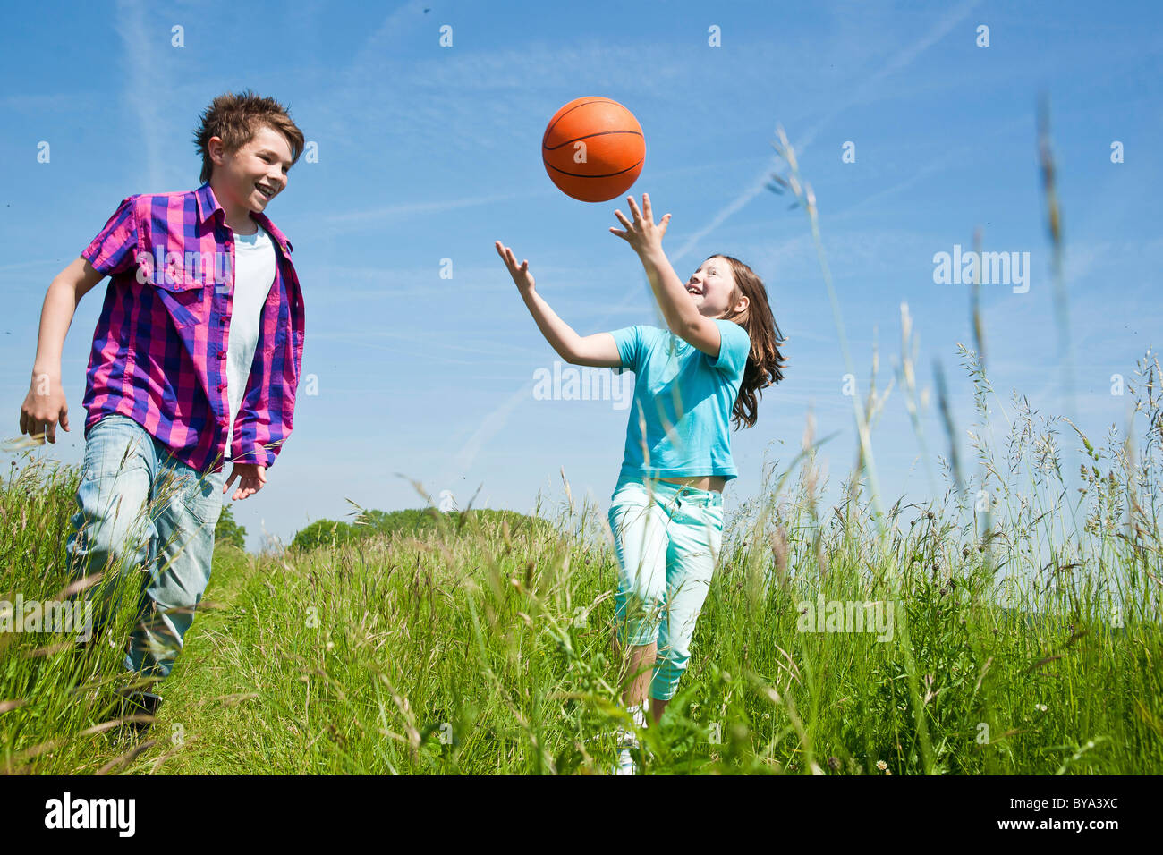 Children with a ball hi-res stock photography and images - Alamy