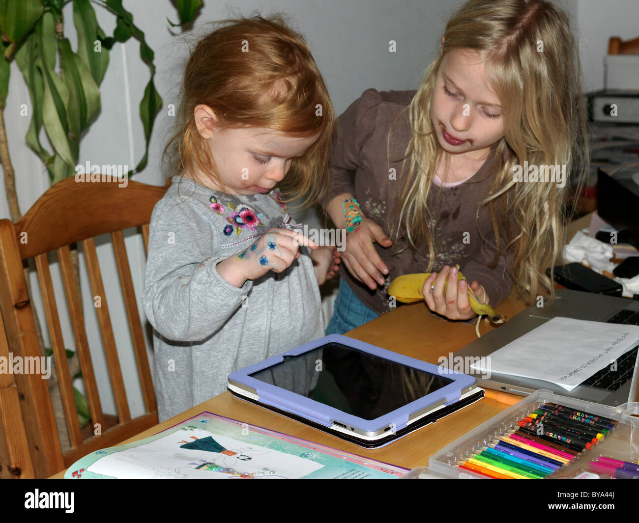 Children playing ipad hi-res stock photography and images - Alamy