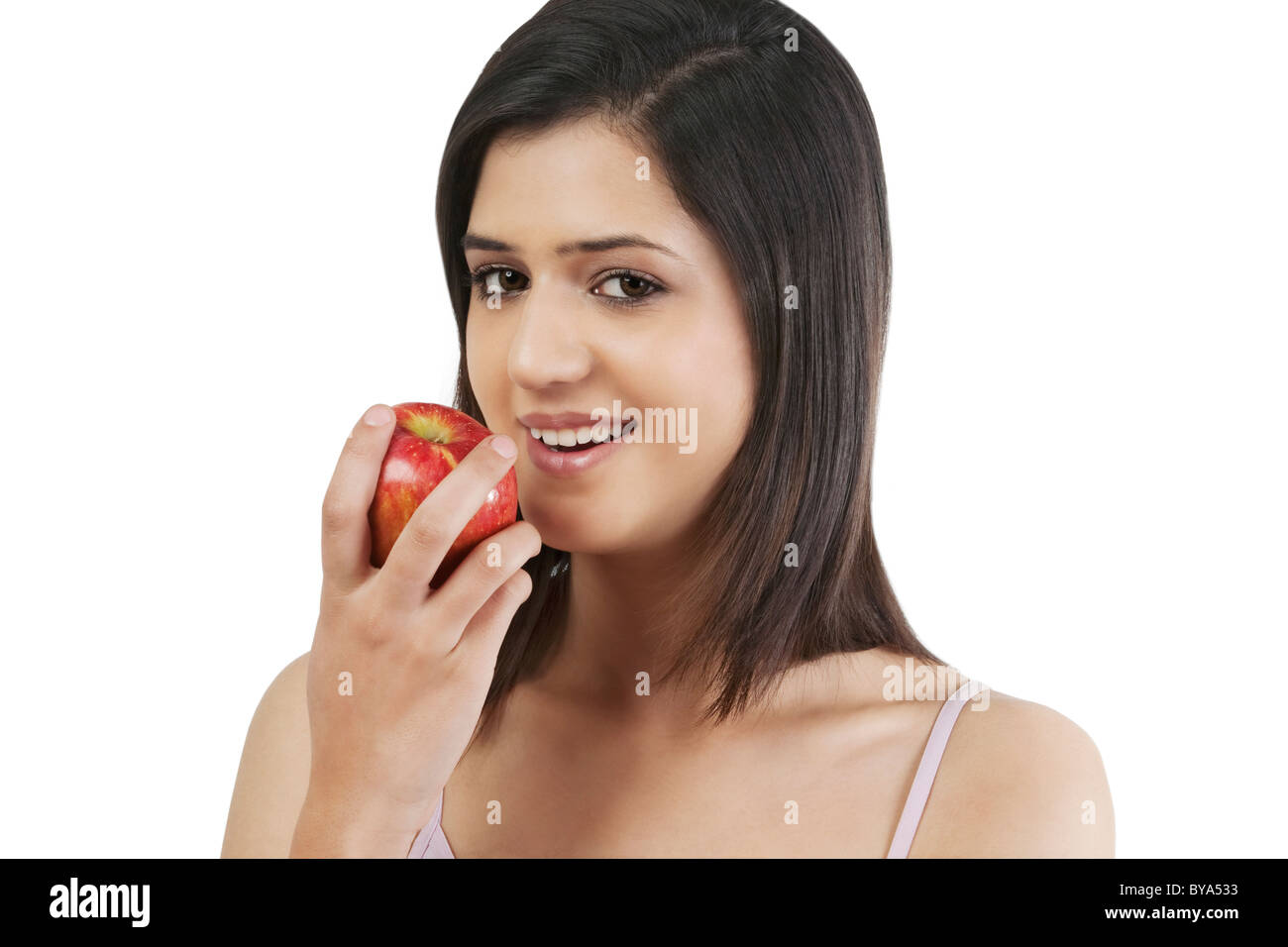 Woman eating an apple Stock Photo - Alamy