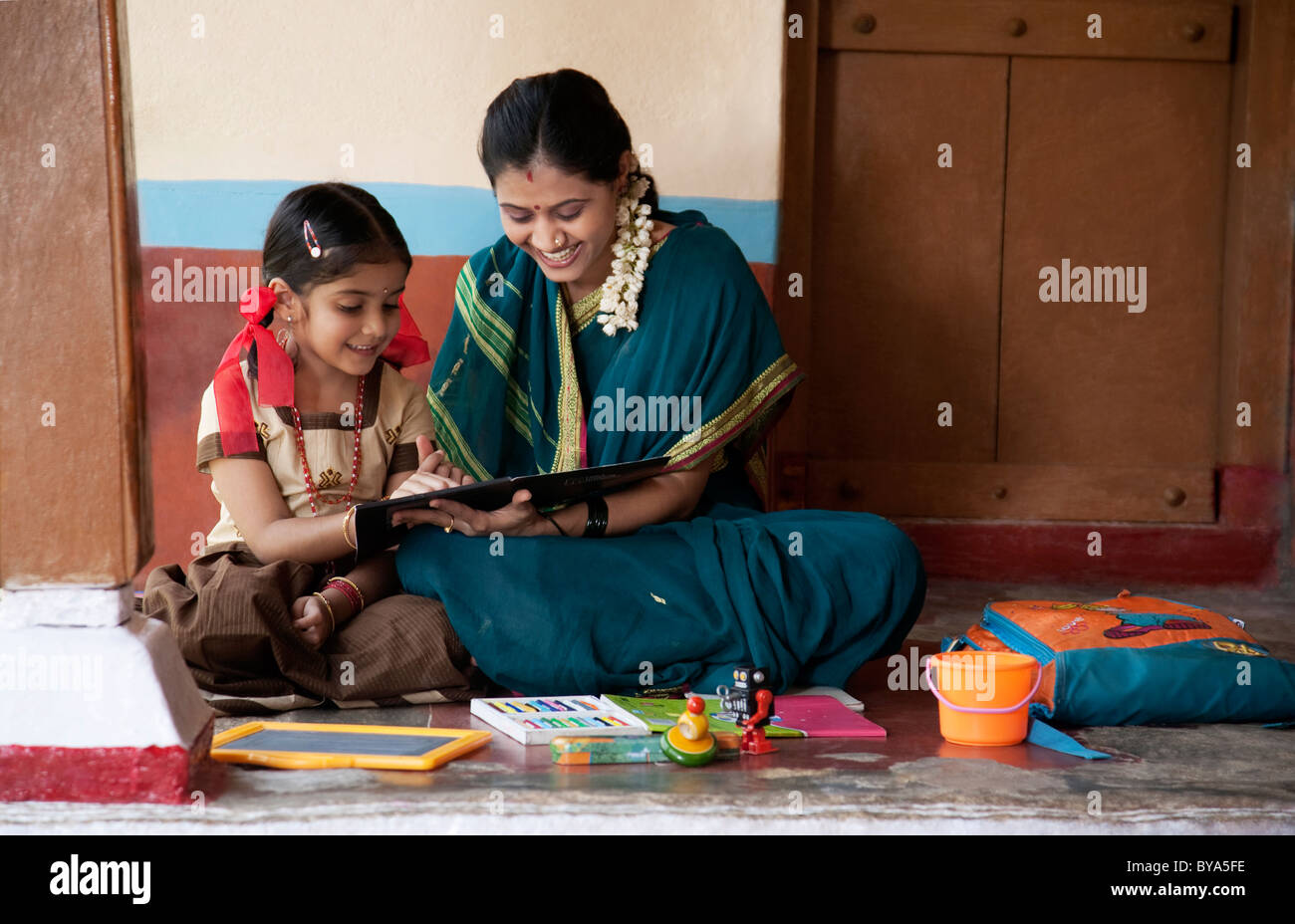 Indian parents teaching children hi-res stock photography and images ...