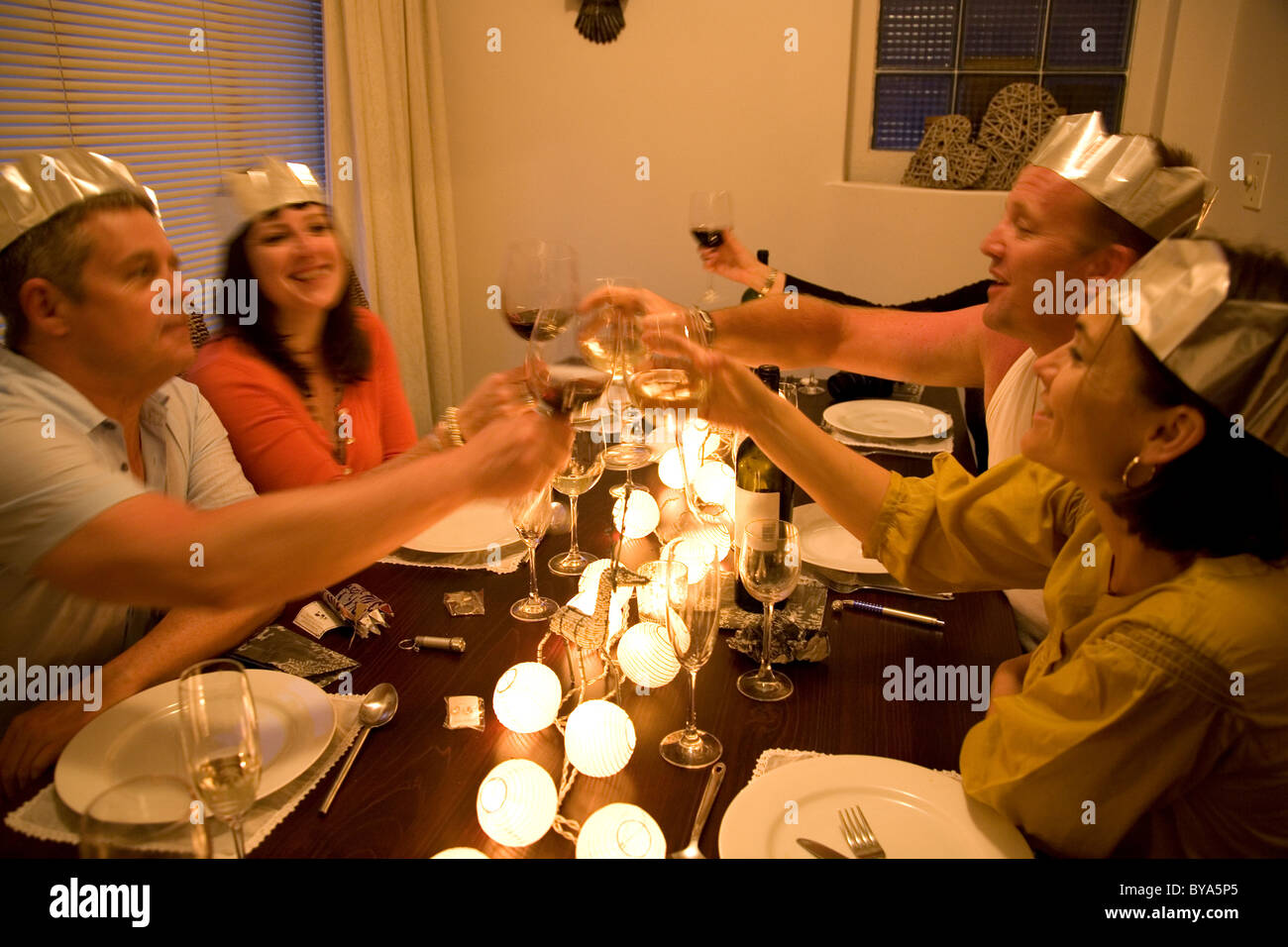 Group toasting one another at Xmas Table Stock Photo - Alamy