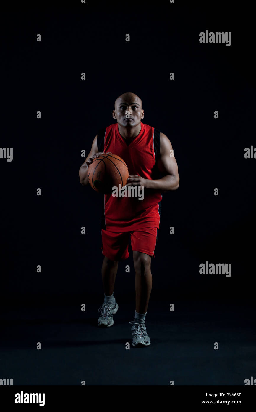 Man playing basketball Stock Photo - Alamy