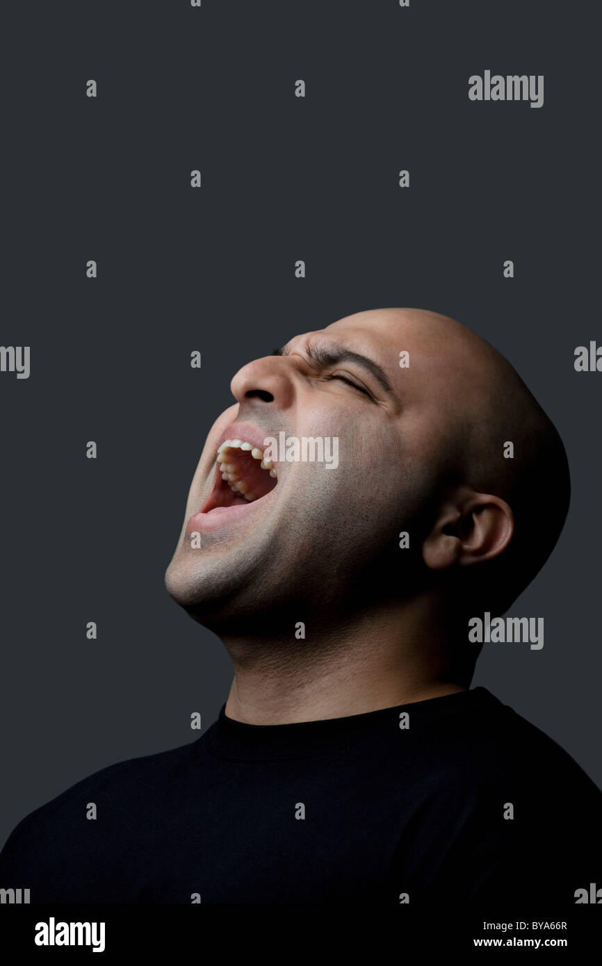 Bald man screaming Stock Photo - Alamy