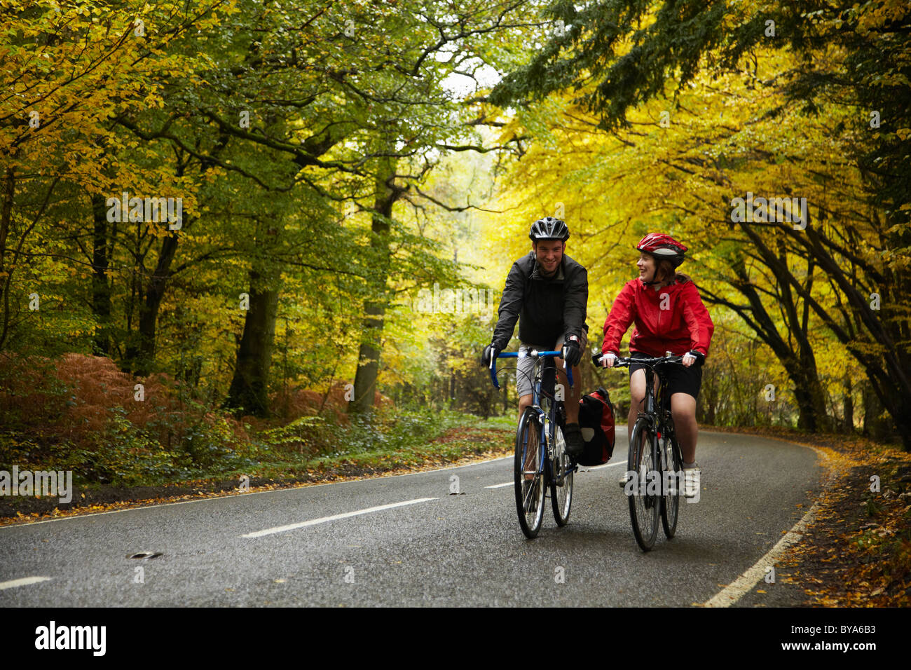 Couple cycling along cycle hi-res stock photography and images - Alamy
