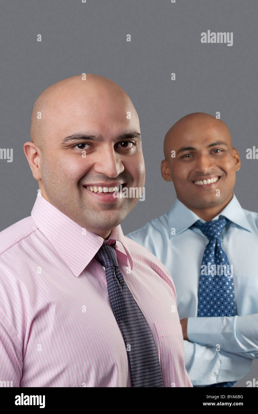 Portrait of two bald executives Stock Photo - Alamy