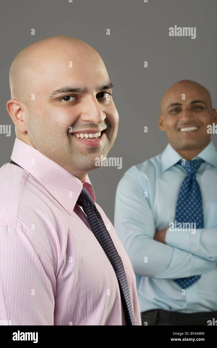 Portrait of two bald executives Stock Photo - Alamy