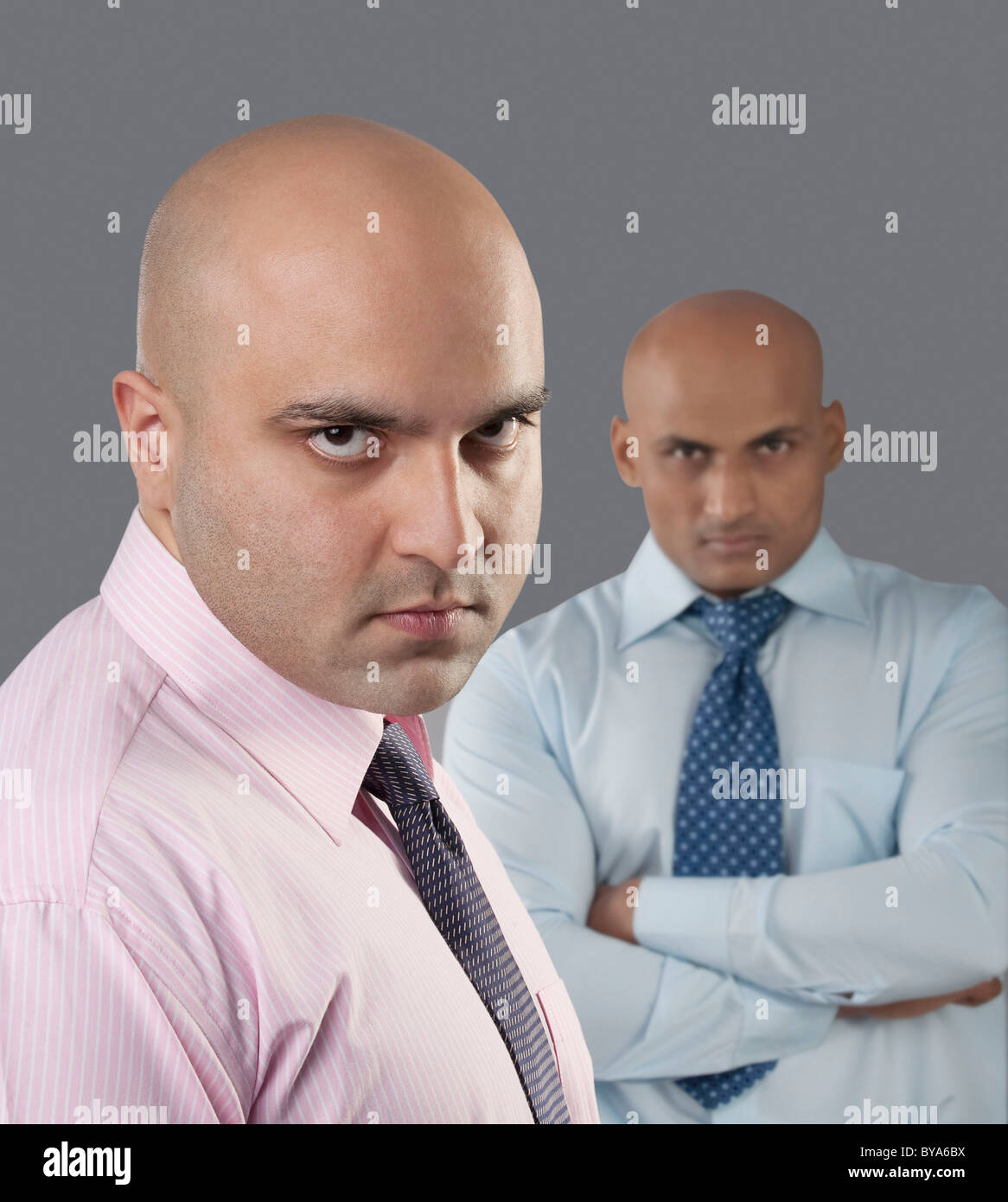 Portrait of two bald executives Stock Photo - Alamy