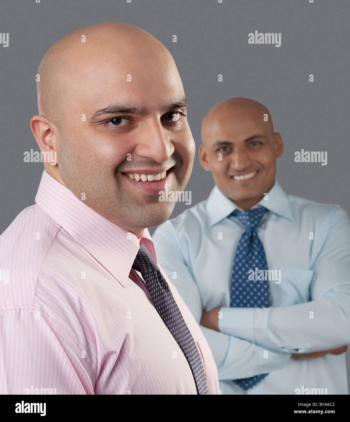 Portrait of two bald executives Stock Photo - Alamy