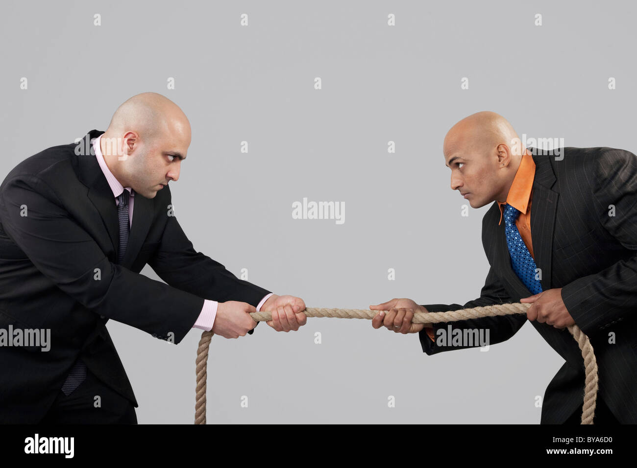 Tug of war between two businessmen Stock Photo - Alamy