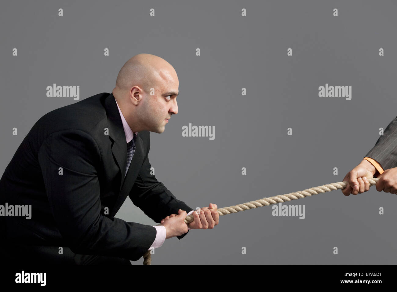 Man pulling on rope hi-res stock photography and images - Alamy
