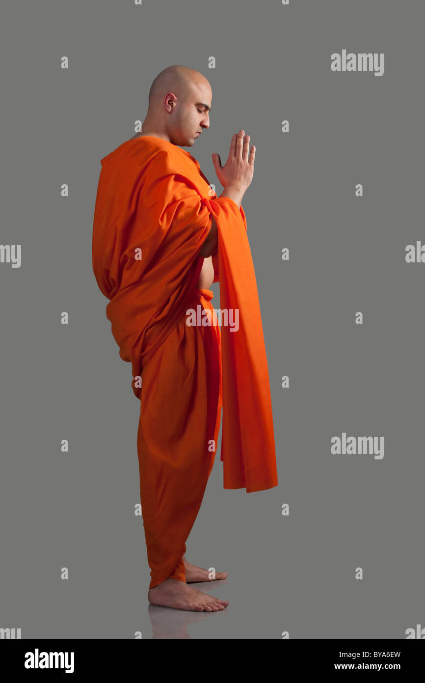 A monk praying Stock Photo - Alamy