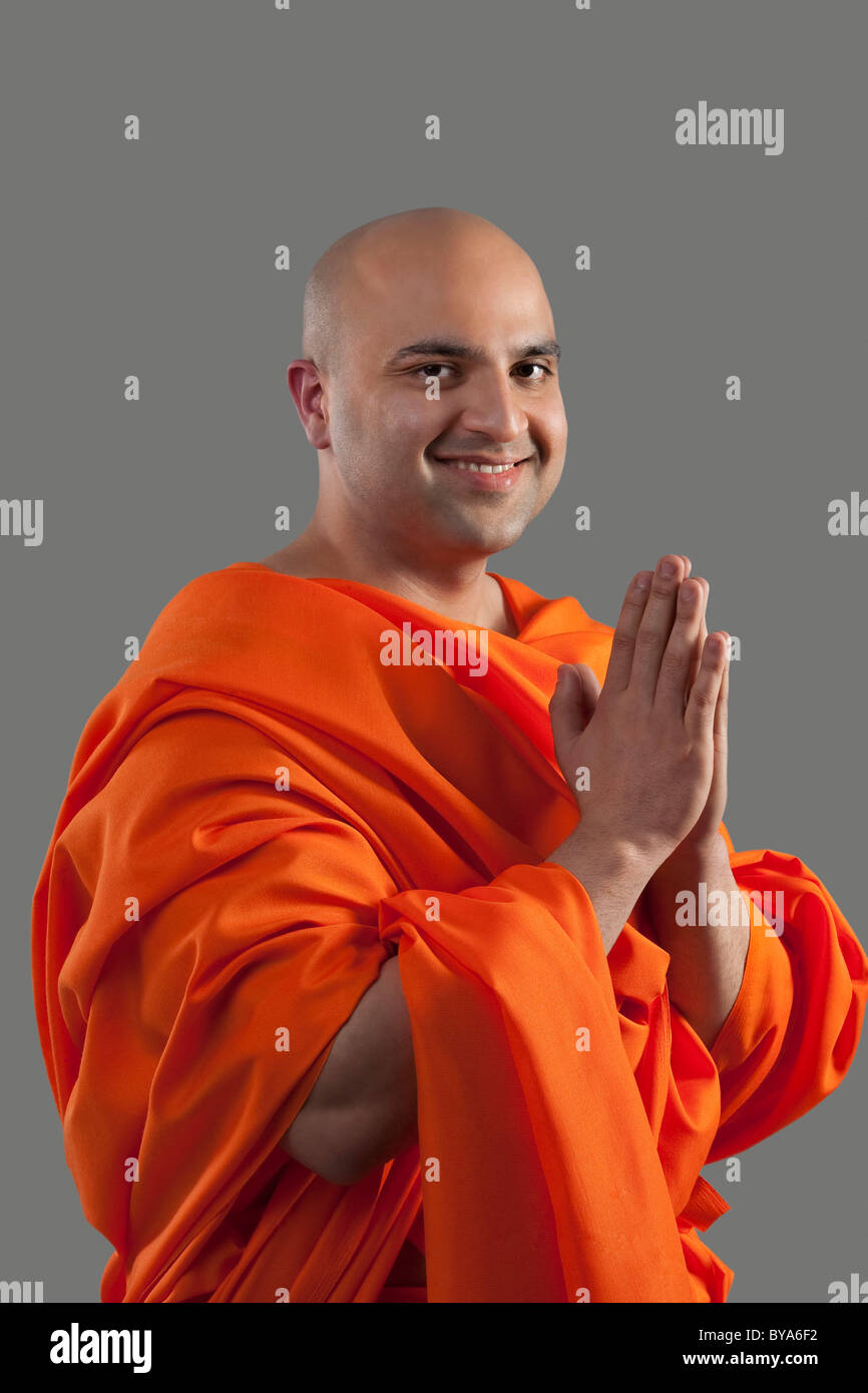 Portrait of a monk praying Stock Photo - Alamy