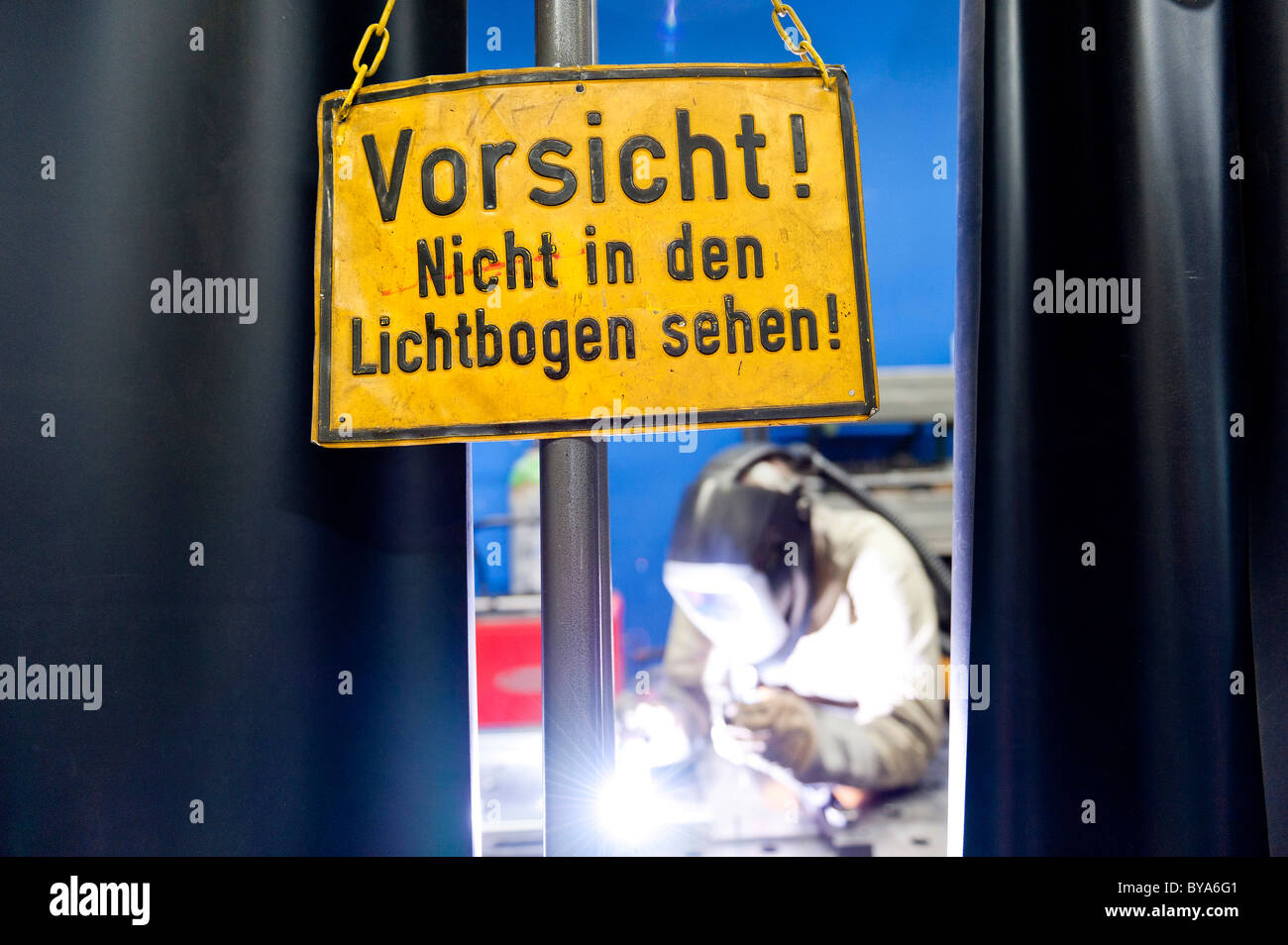 Sign, caution, do not look into the light, arc welding, welding booth ...