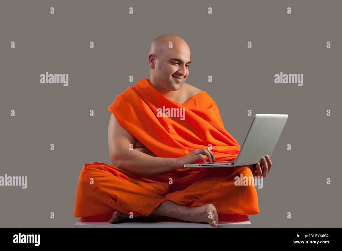Young and adult monk laptop hi-res stock photography and images - Alamy
