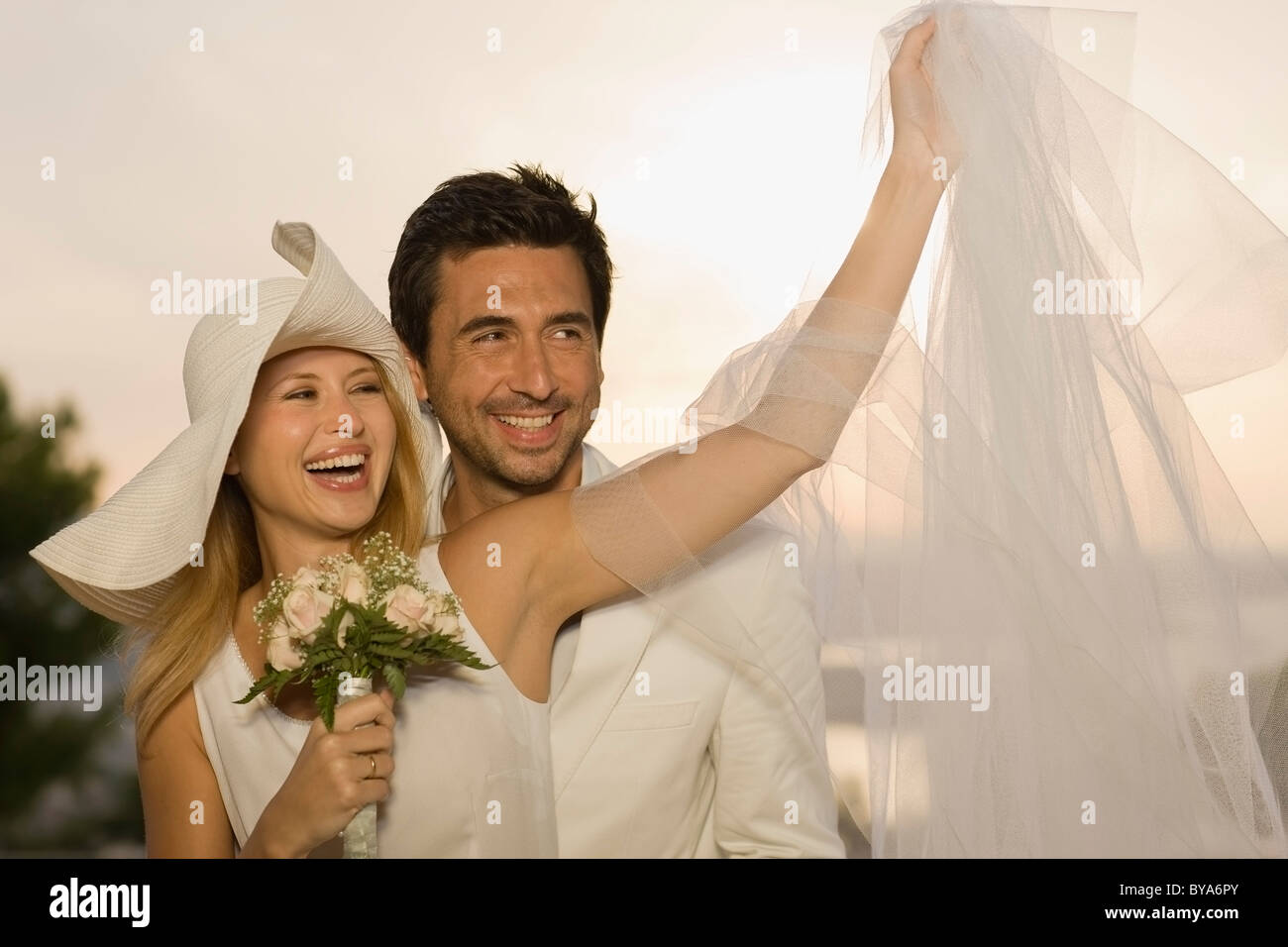 Bridal couple having fun Stock Photo - Alamy