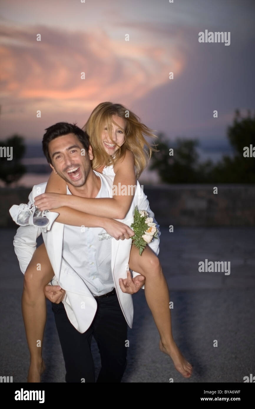 Man carrying his bride Stock Photo - Alamy