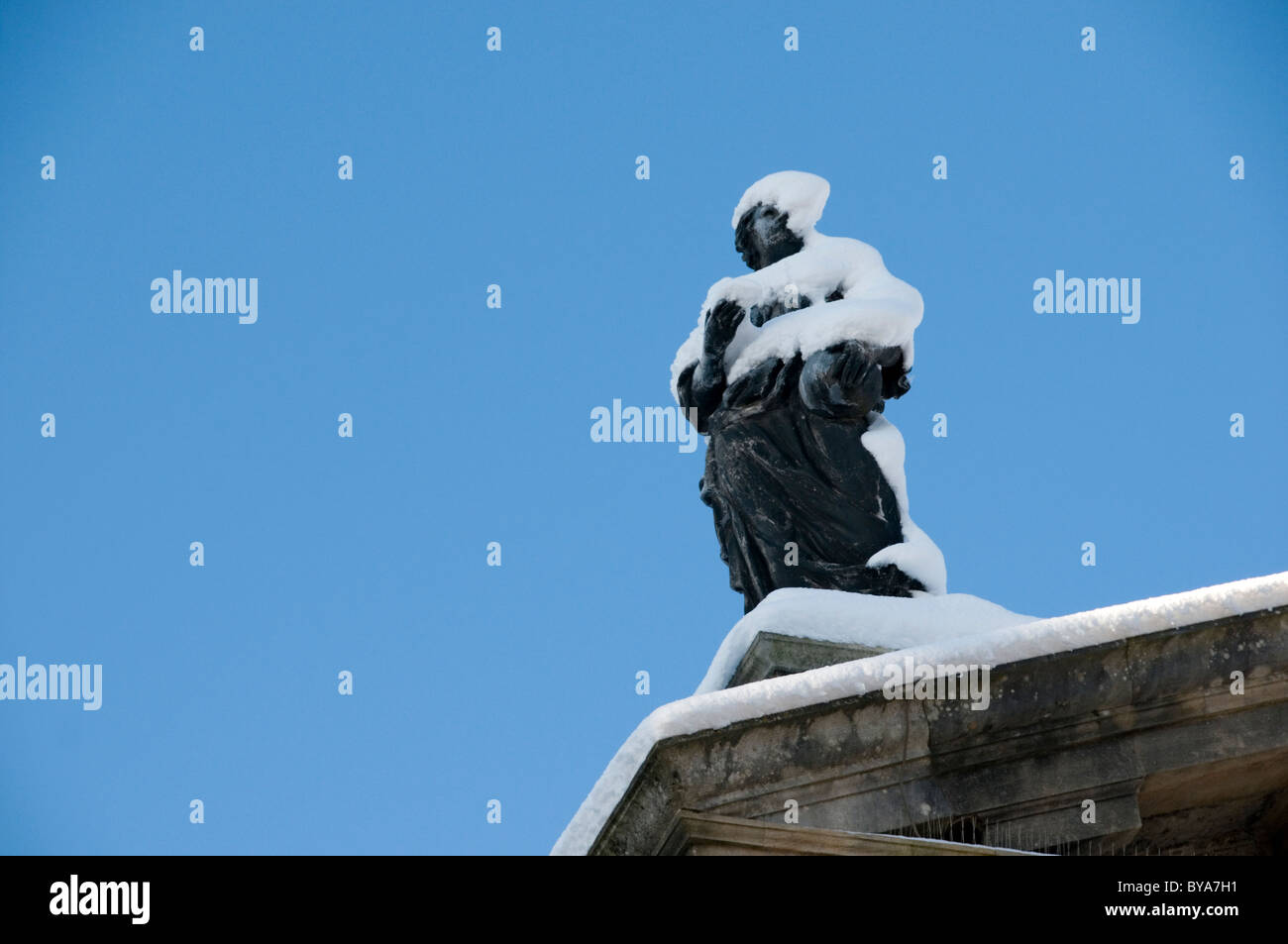 Snow covered statue of Muse on Clarendon Building, Oxford, UK Stock ...