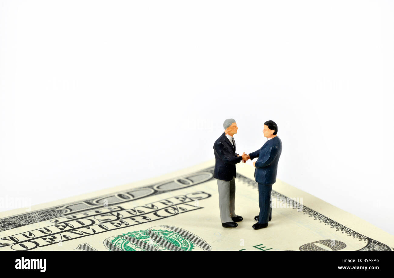 Manager figures on U.S. dollars, symbolic image for business, business ...